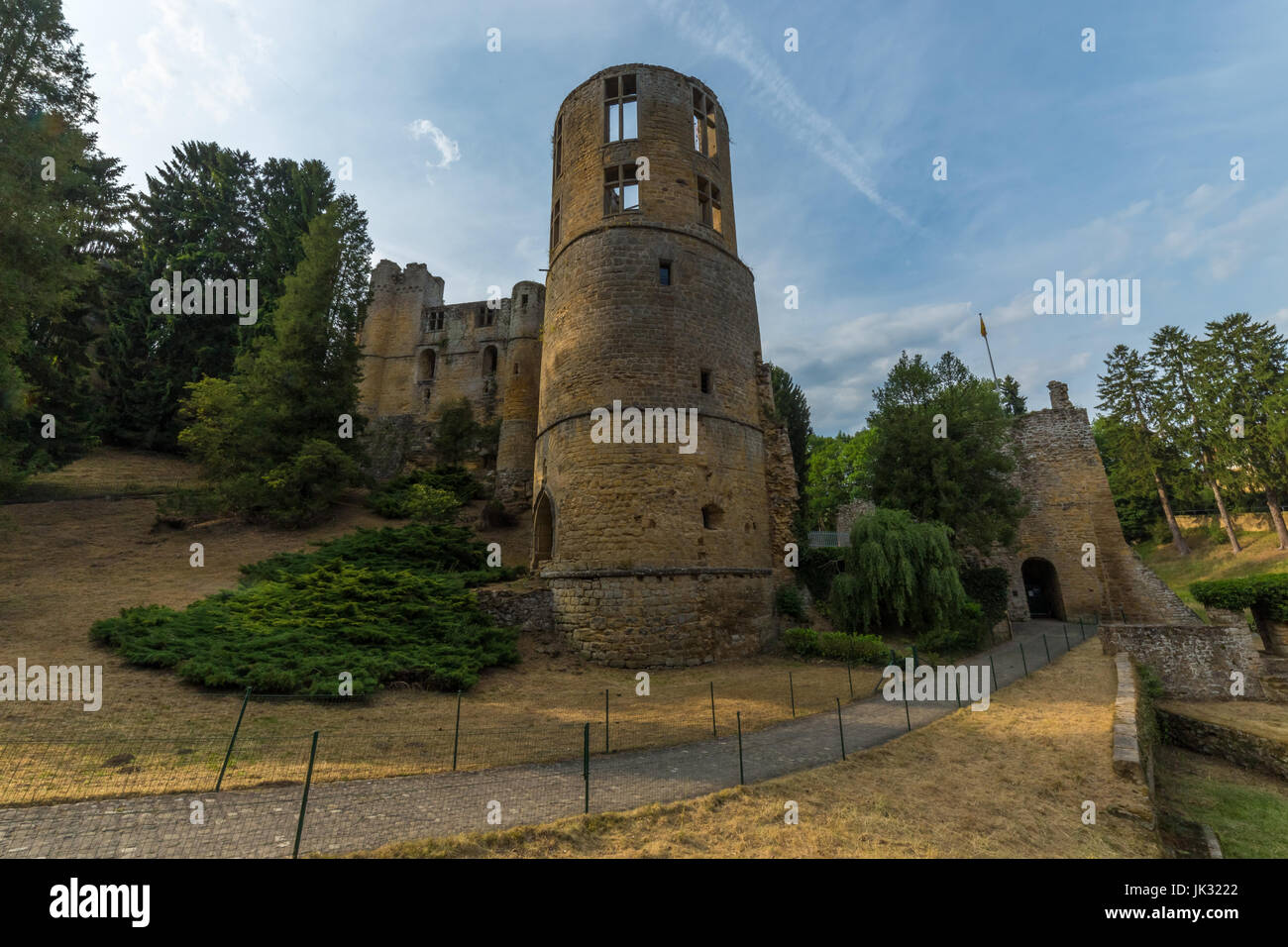 Medieval castle among trees and blue sky in Luxembourg Stock Photo - Alamy