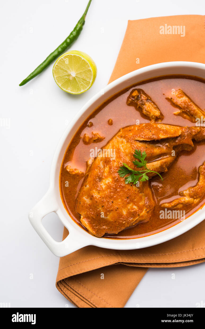 Indian spicy Chicken curry or masala chicken with prominent leg piece ...