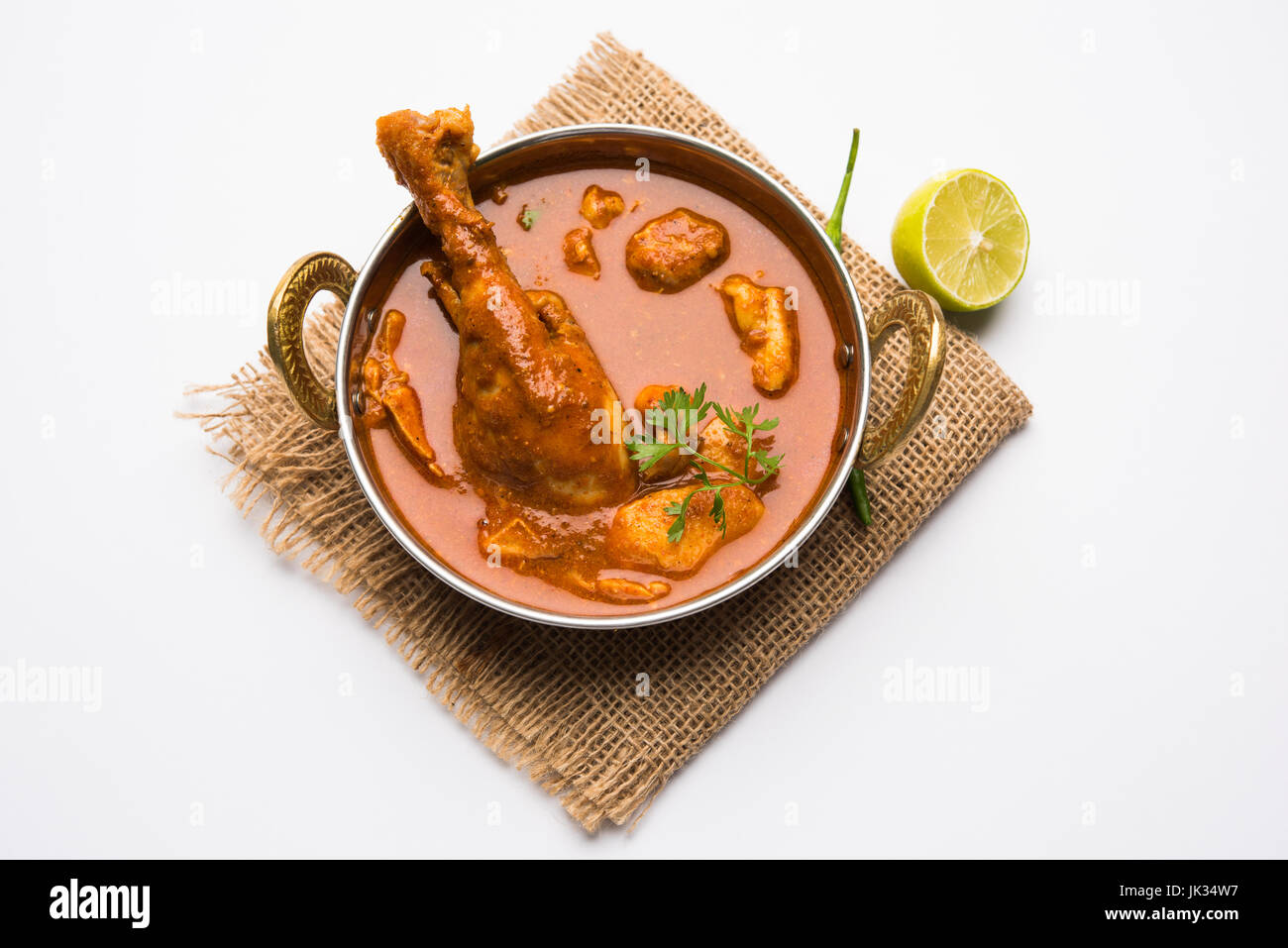 Indian spicy Chicken curry or masala chicken with prominent leg piece ...