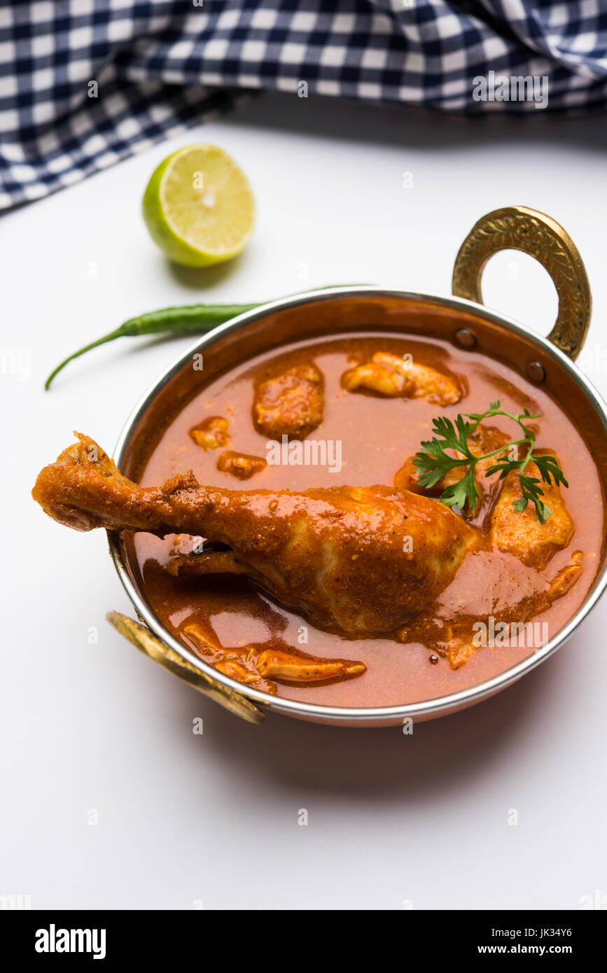 Indian spicy Chicken curry or masala chicken with prominent leg piece ...
