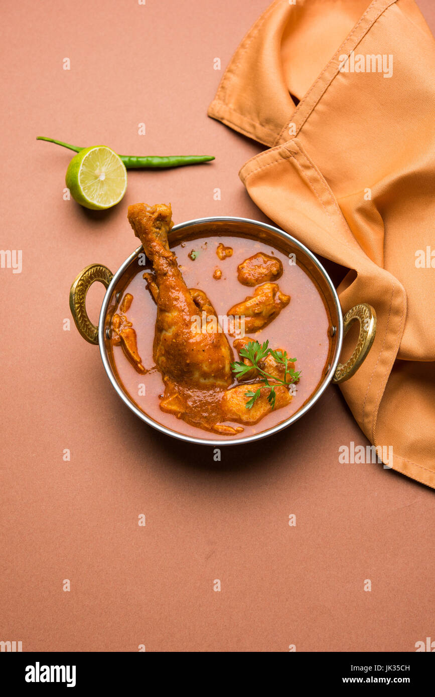 Indian spicy Chicken curry or masala chicken with prominent leg piece ...