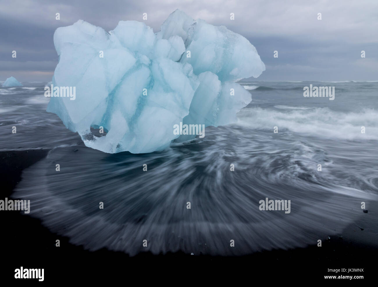 Mini iceberg on black sand beach. Iceland Stock Photo - Alamy