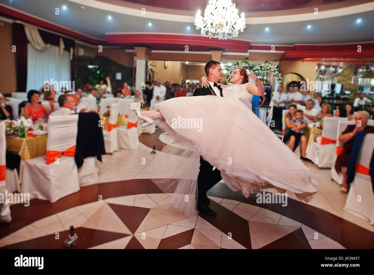 The first dance of newly married couple at their wedding party in ...