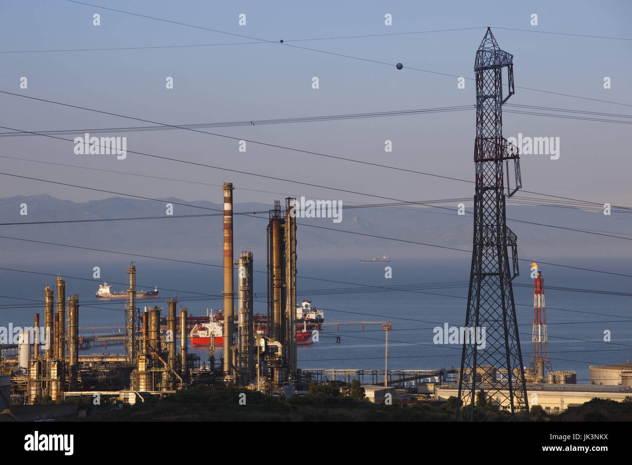 Italy, Sardinia, Southwest Sardinia, Porto Foxi, Oil refinery, sunset ...