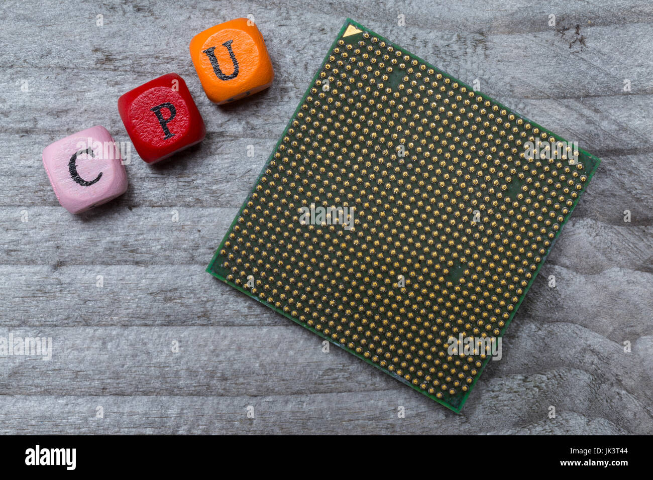 CPU letter cube and processor on gray wood visualization Stock Photo ...