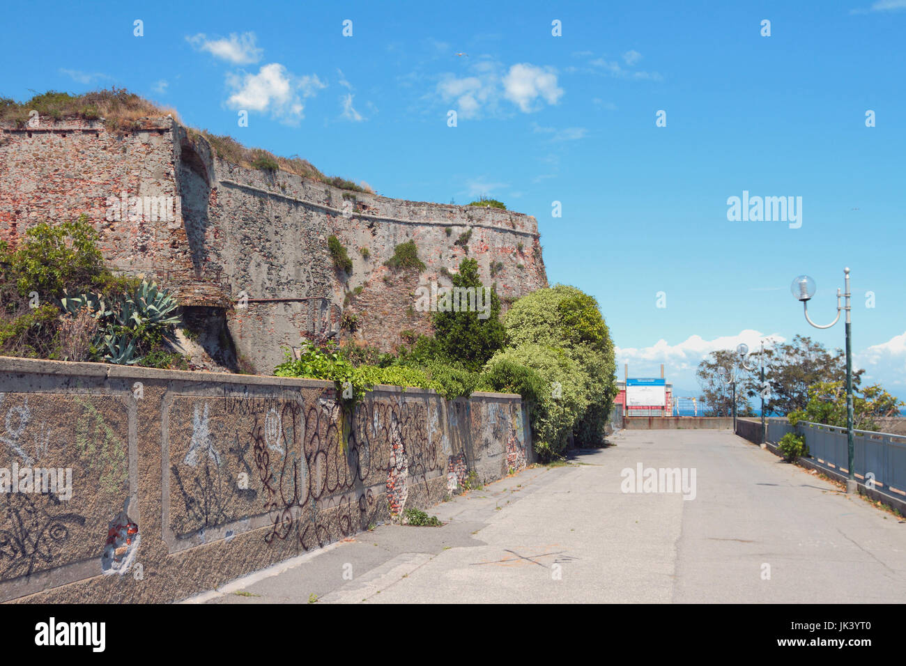 Promenade under walls of ancient fortress. Savona, Italy Stock Photo ...