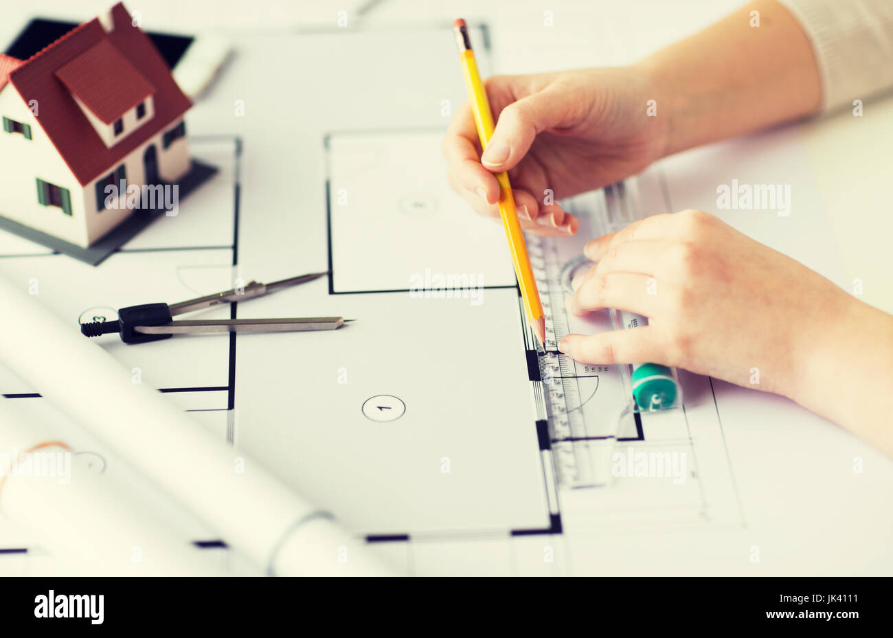 close up of hands with compass measuring blueprint Stock Photo - Alamy