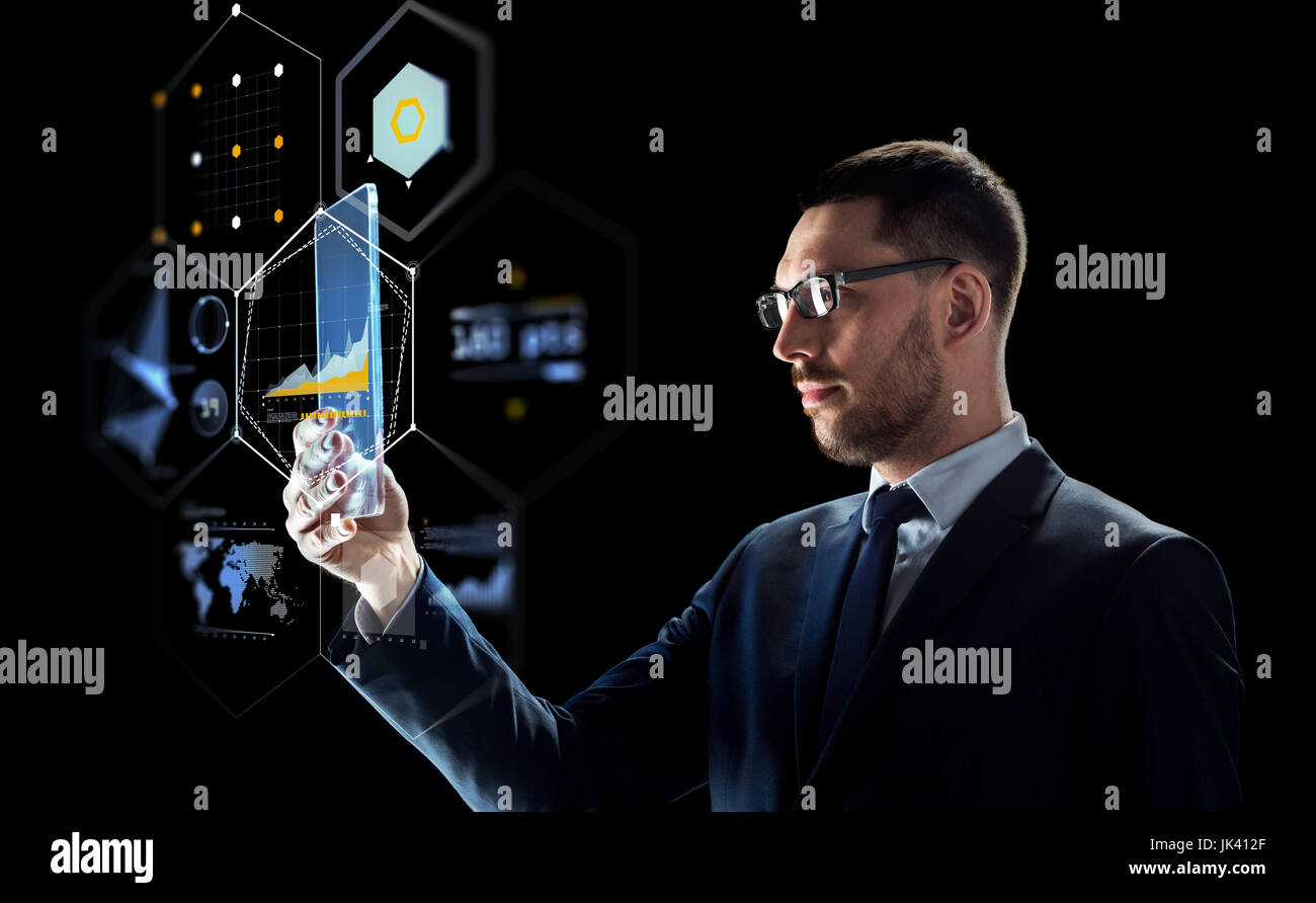 businessman with tablet pc and virtual projections Stock Photo - Alamy