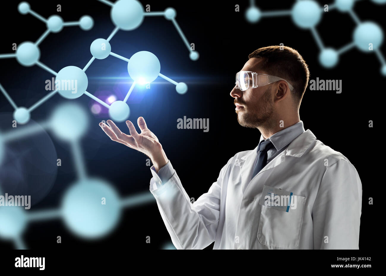 scientist in lab coat and goggles with molecules Stock Photo - Alamy