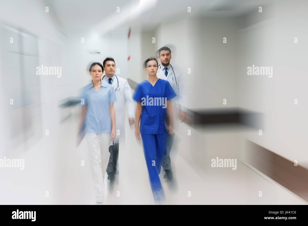 group of medics or doctors walking along hospital Stock Photo - Alamy