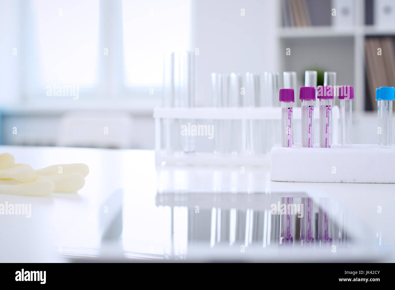 Research laboratory working space. Test tubes and tablet PC are lying ...