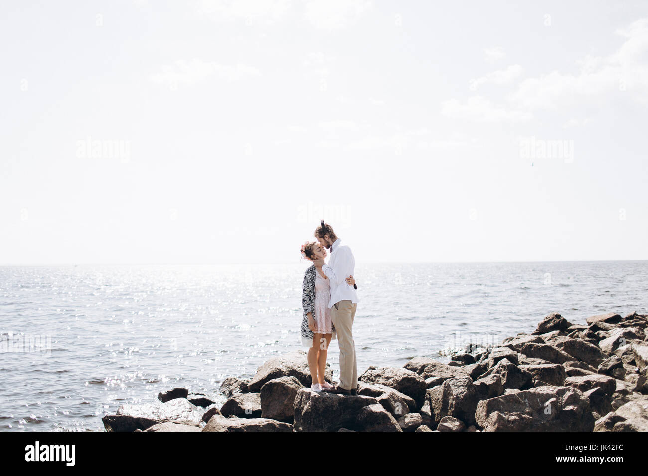 Young couple kissing rocks hi-res stock photography and images - Alamy
