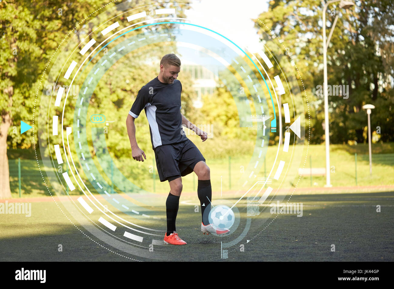 soccer player playing with ball on field Stock Photo - Alamy