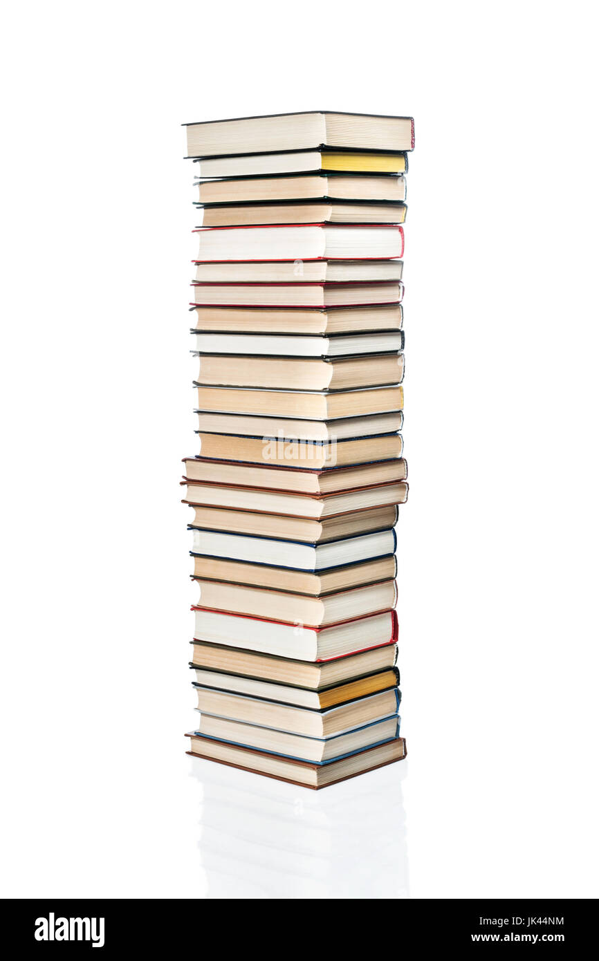 High stack of various books stacked one on another, isolated on white ...