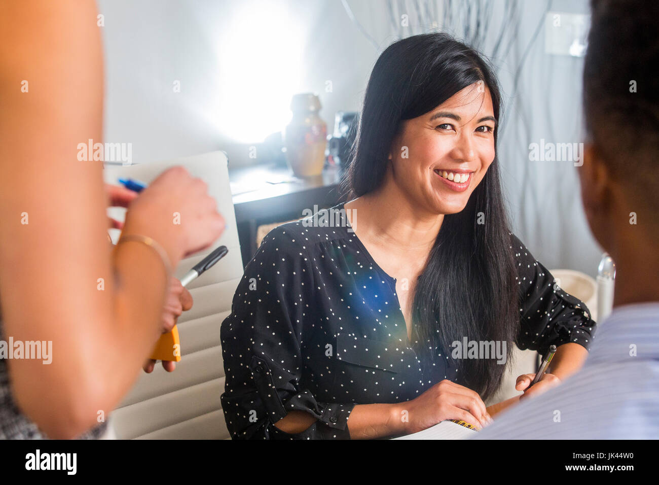 Young pretty smiling business hi-res stock photography and images - Alamy