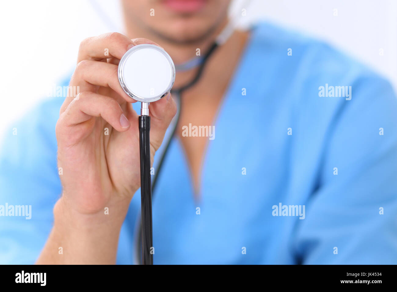 Close-up of male surgeon doctor using stethoscope , focus on ...