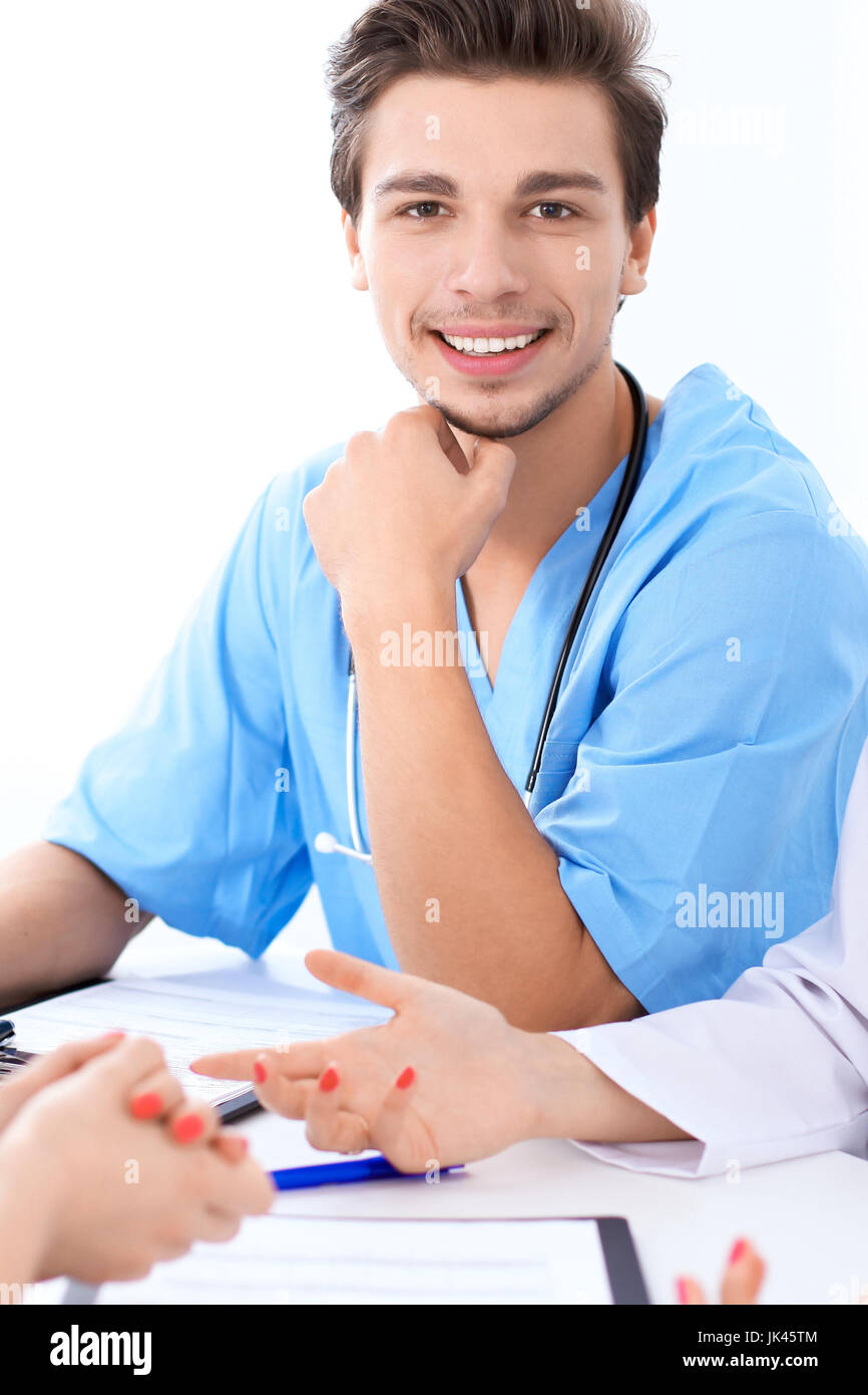 Attractive male surgeon doctor at medical meeting or patient ...