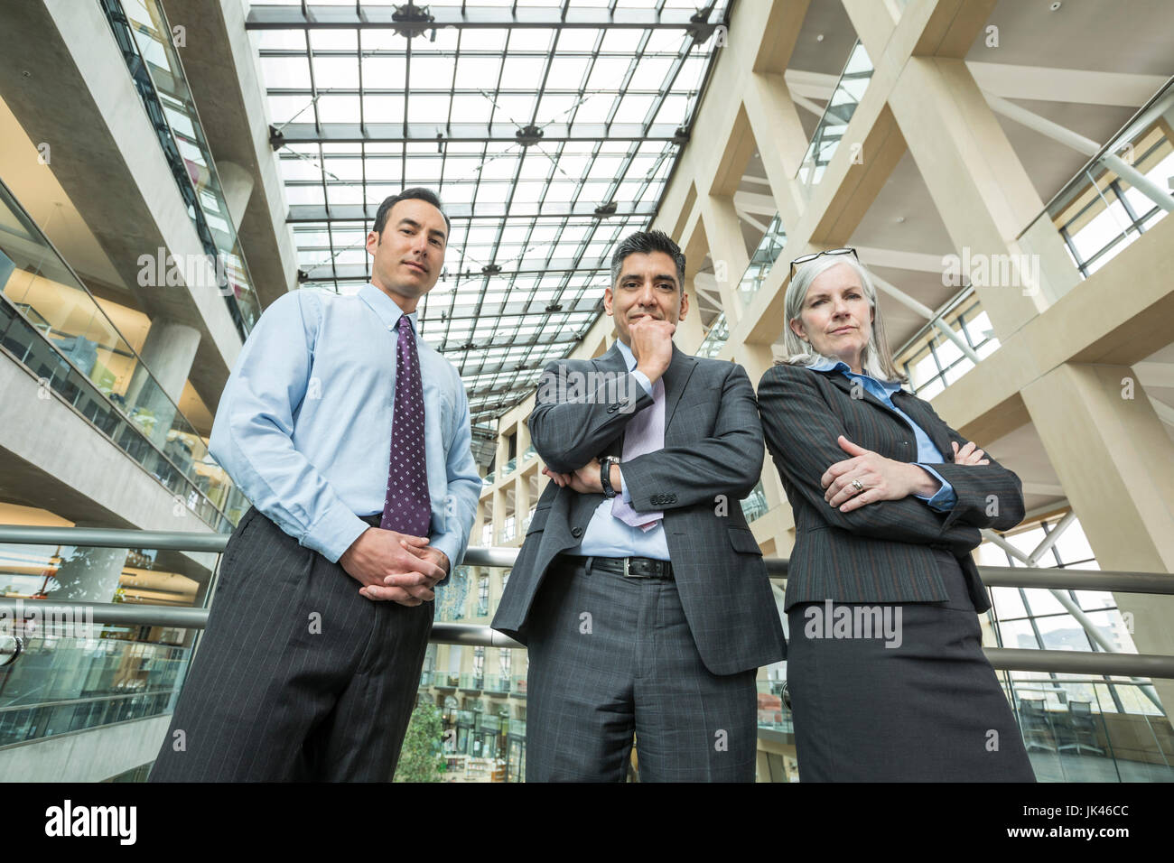 Portrait of serious business people in lobby Stock Photo - Alamy