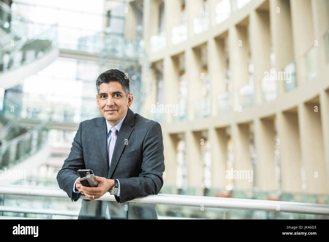Man leaning on balcony railing hi-res stock photography and images - Alamy