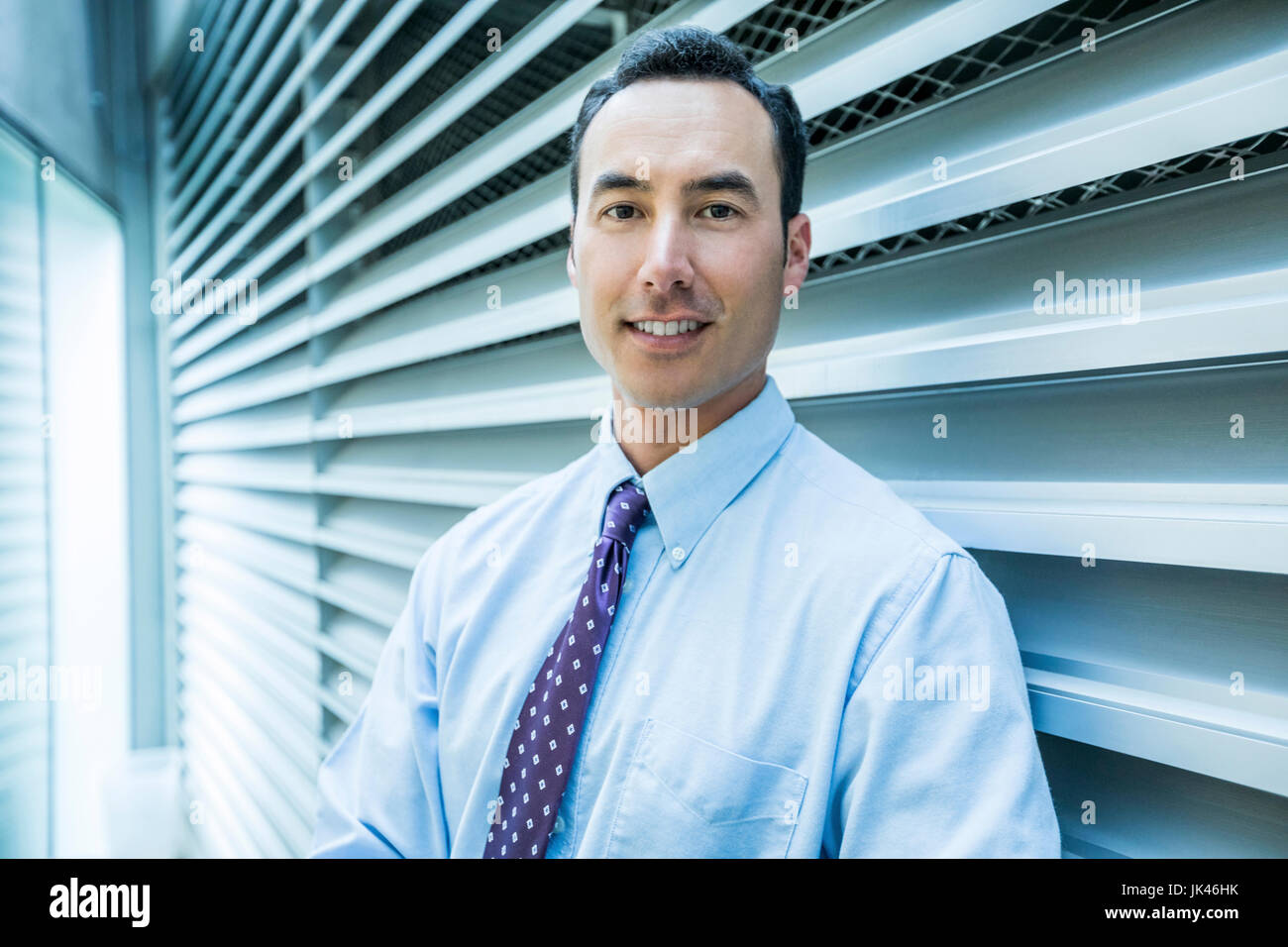 Portrait of smiling Mixed Race businessman Stock Photo - Alamy