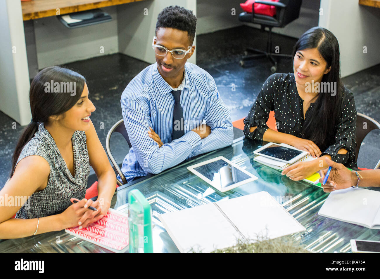 Smiling people talking in meeting Stock Photo - Alamy