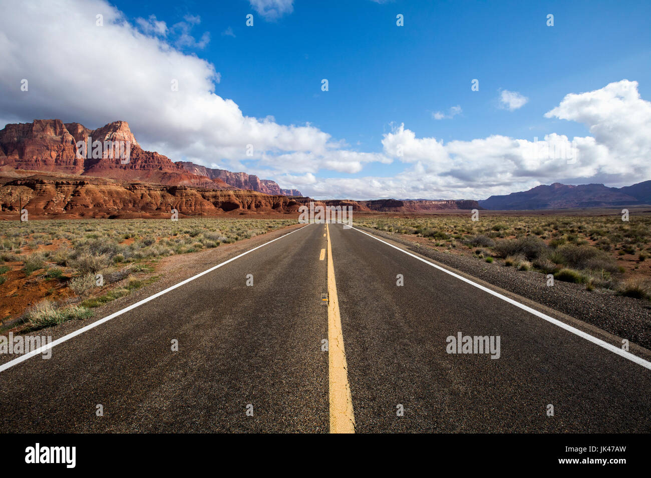 Road to distant desert landscape Stock Photo - Alamy