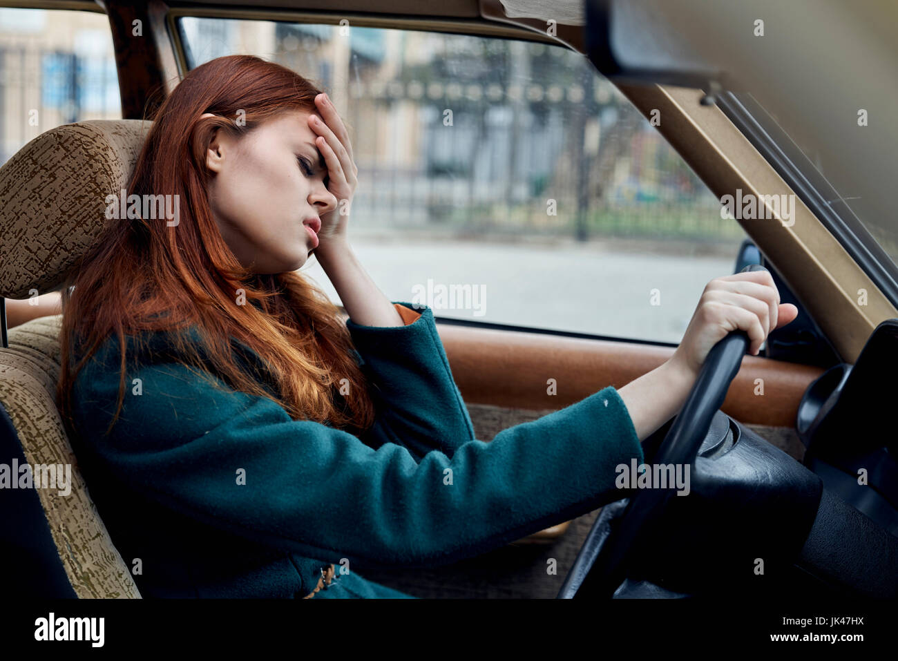 Frustrated Caucasian woman driving car Stock Photo - Alamy