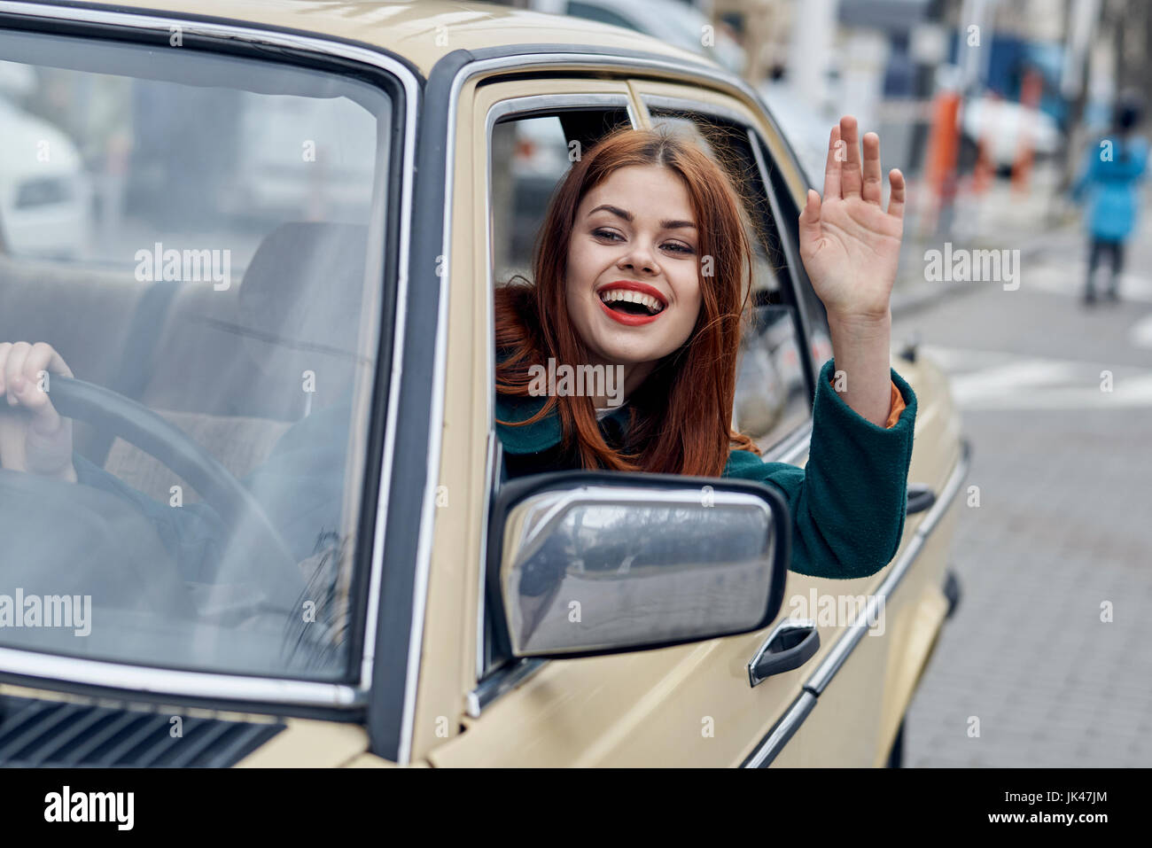 Woman waving and laughing hi-res stock photography and images - Alamy