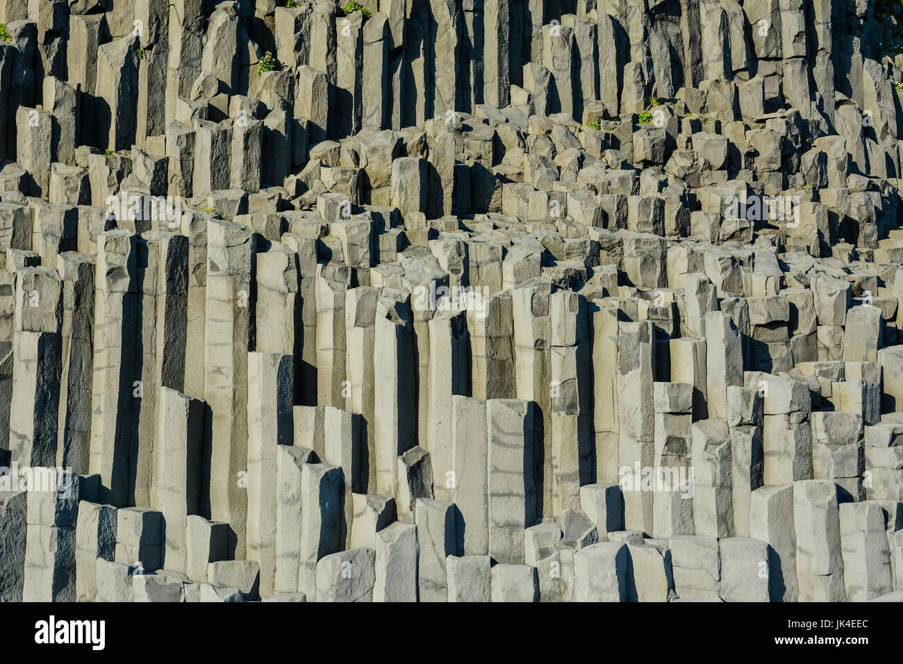 Basalt stone columns on Reynisfjara black beach near Vik town, Iceland on sunny summer day Stock ...