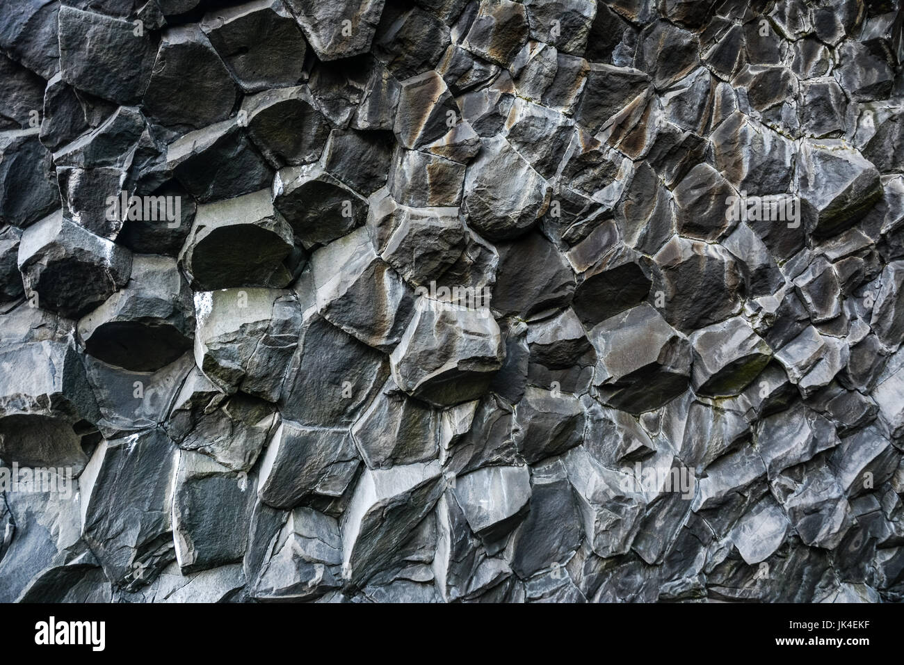 Basalt stone columns close-up on Reynisfjara black beach near Vik town ...
