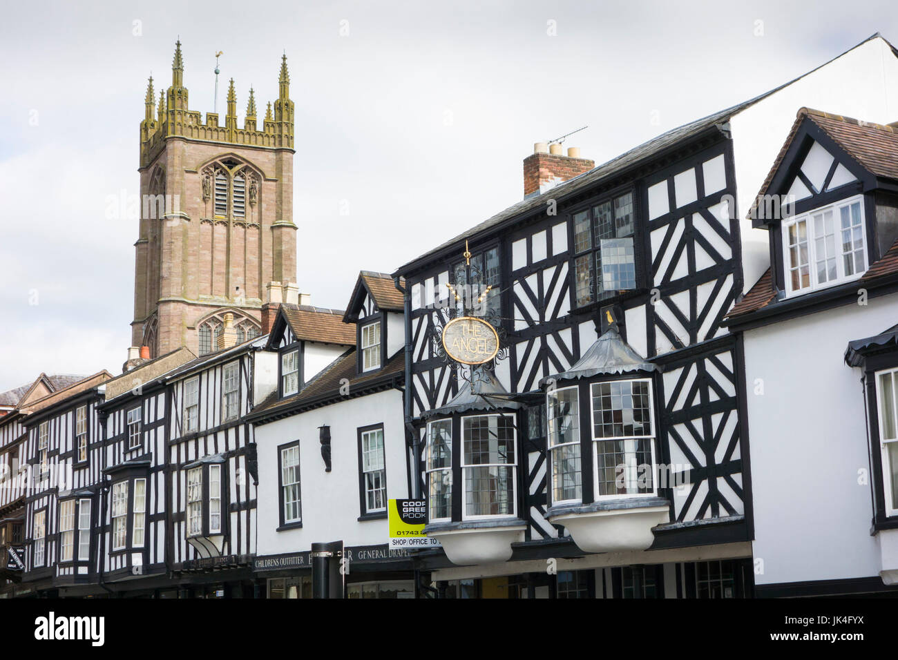 Broad Street in Ludlow, with a row of historic houses, many timber ...