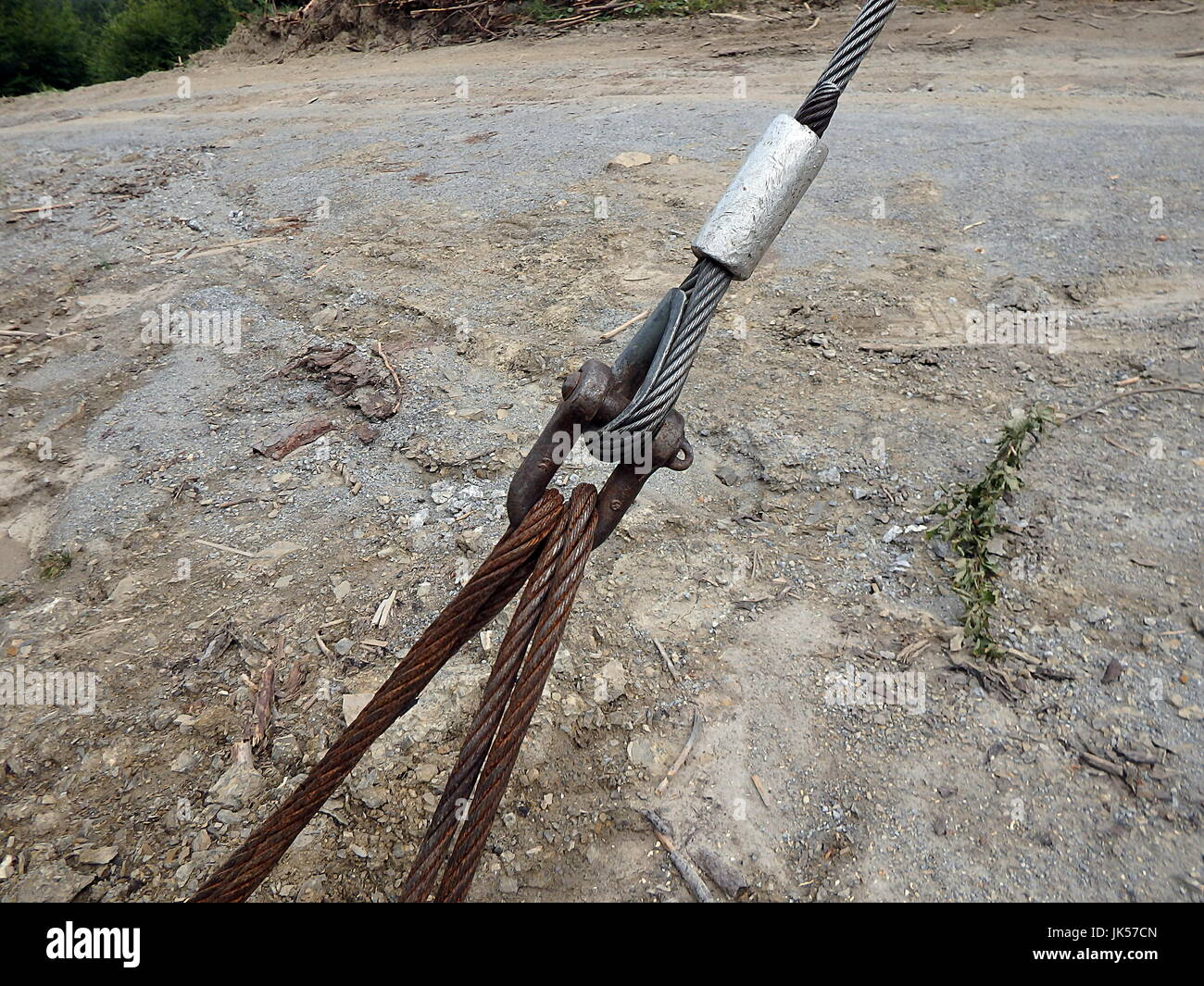 Metal fastening of two steel cables Stock Photo - Alamy
