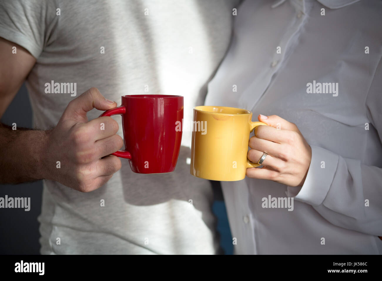 Hands holding cups hi-res stock photography and images - Alamy