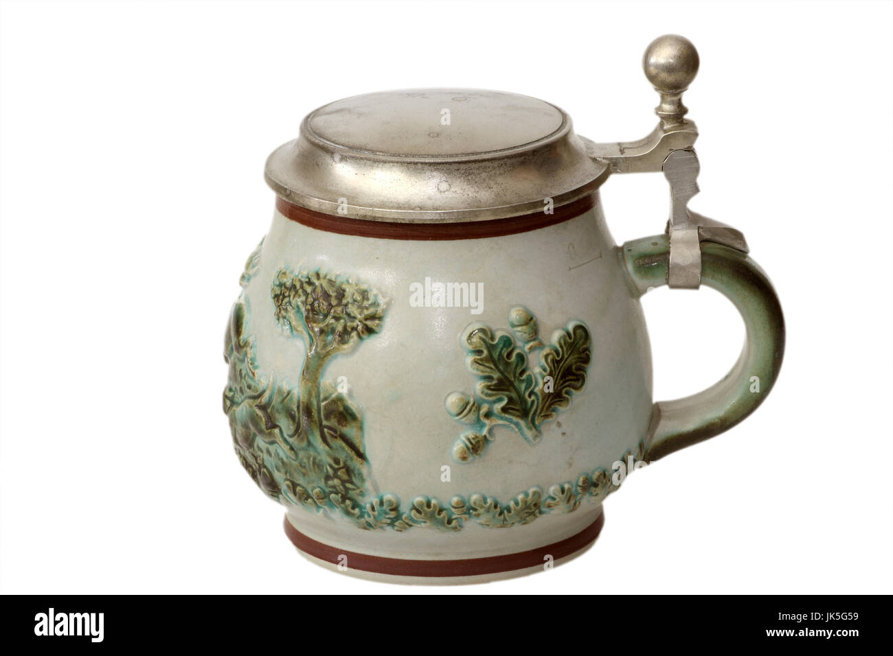A traditional German beer jug with silver lid isolated on white ...