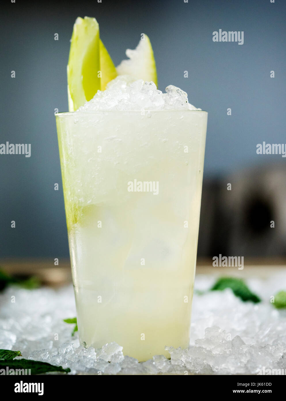 Glass of healthy lemonade with lemon and ice Stock Photo - Alamy