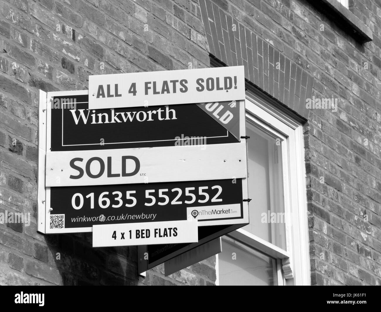 Estate Agent sign above properties showing all four residential flats ...