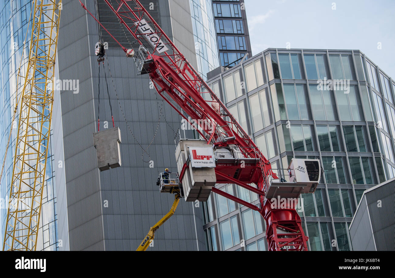 dpatop - Workers of a recovery team remove the concrete weights of the ...