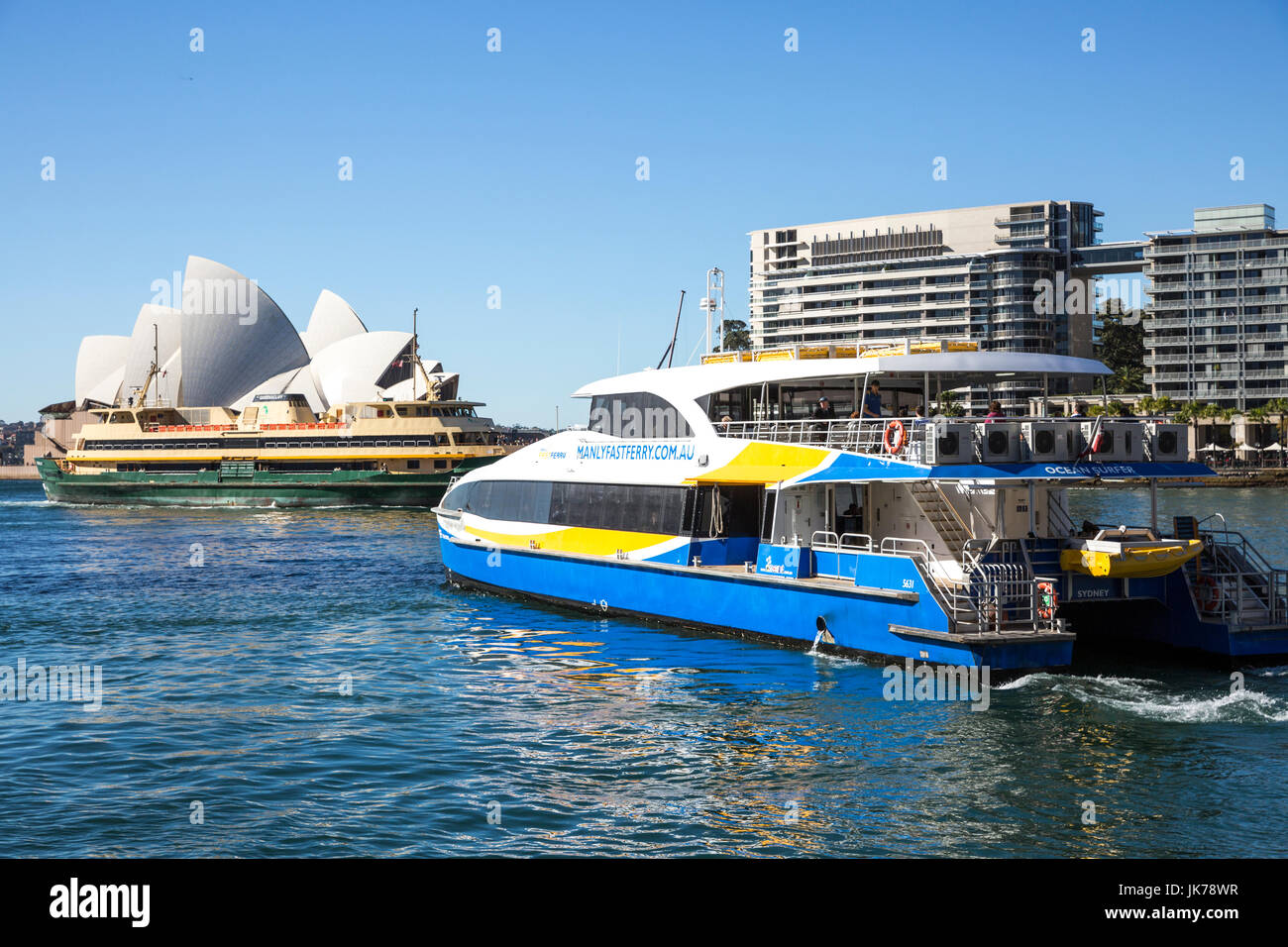 Manly Fast ferry and traditional Sydney ferry pass by Sydney opera ...