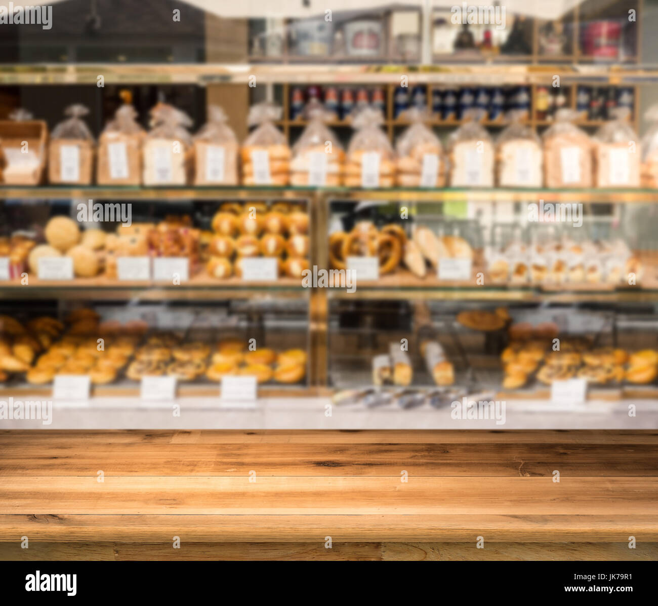 wooden counter with bakery shop blurred background Stock Photo - Alamy