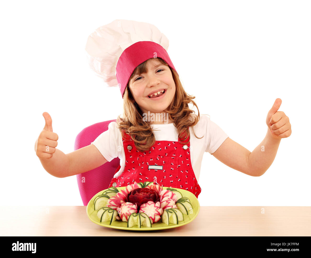 happy little girl cook with thumbs up and decorated salad Stock Photo ...
