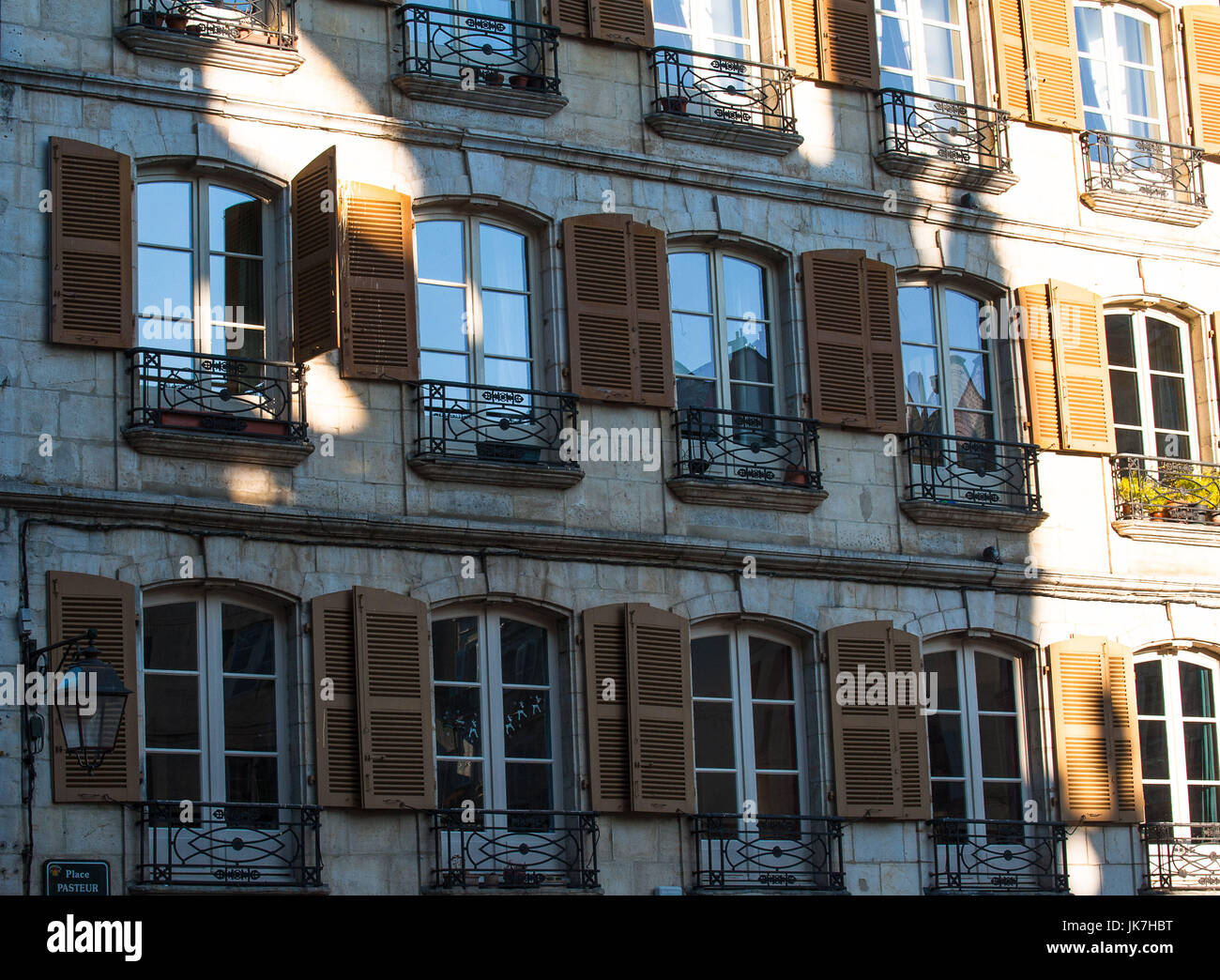 Typical french windows with colorful shutters Stock Photo - Alamy
