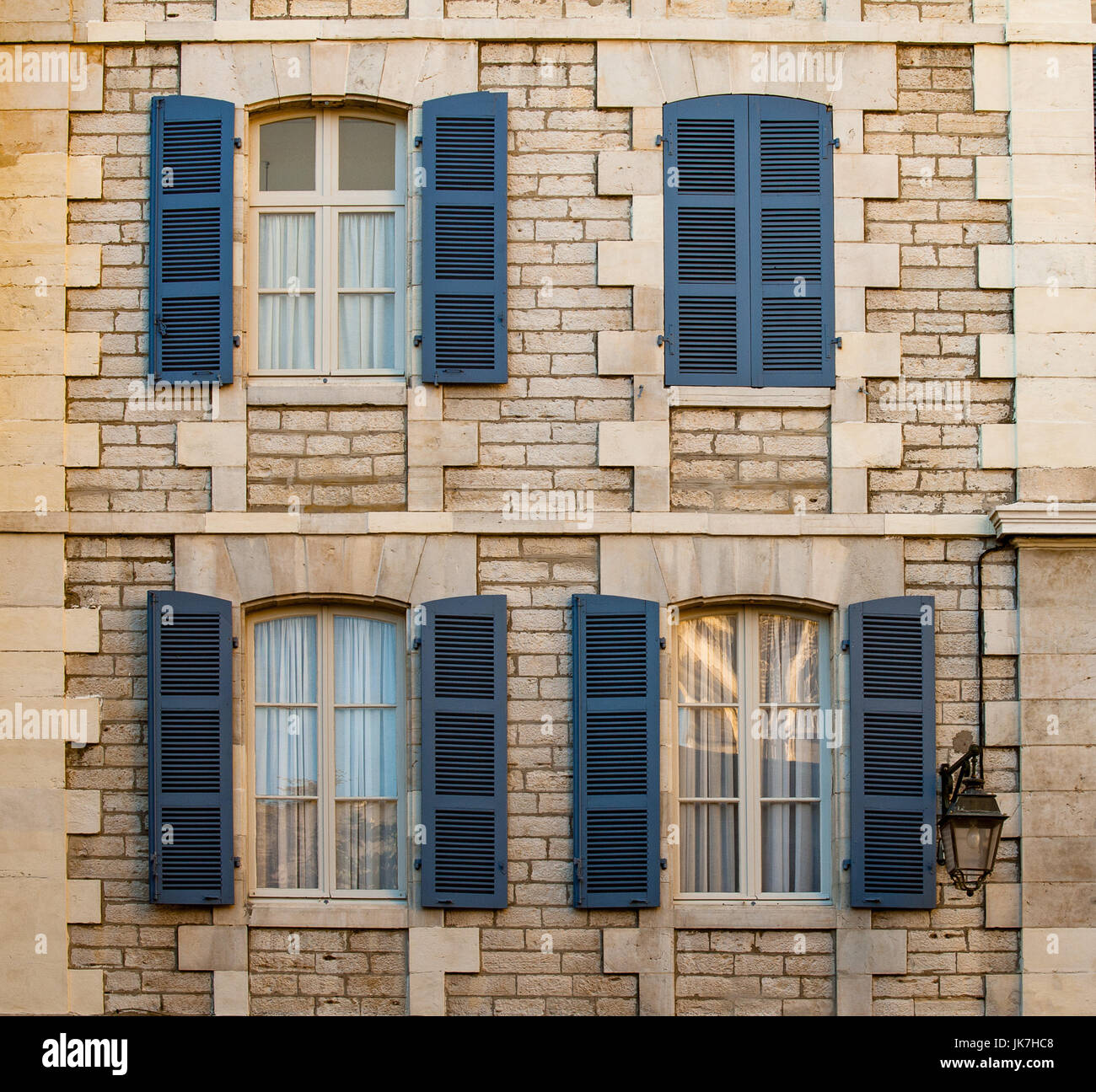 Typical french windows with colorful shutters Stock Photo - Alamy