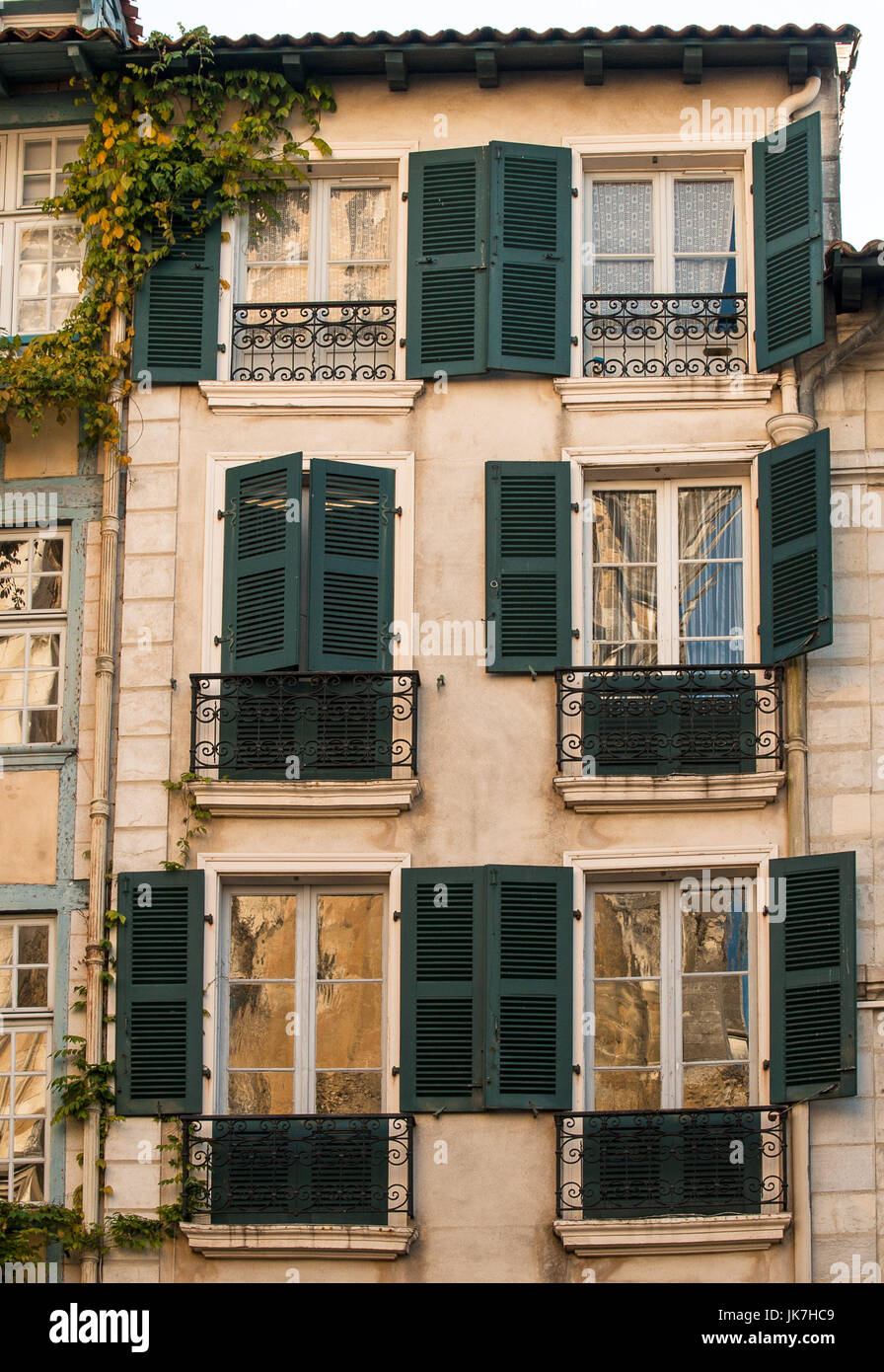 Typical french windows with colorful shutters Stock Photo - Alamy