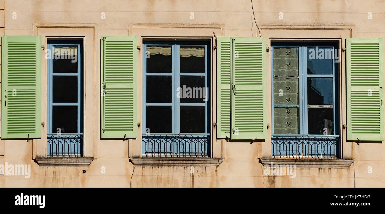 Typical french windows with colorful shutters Stock Photo - Alamy