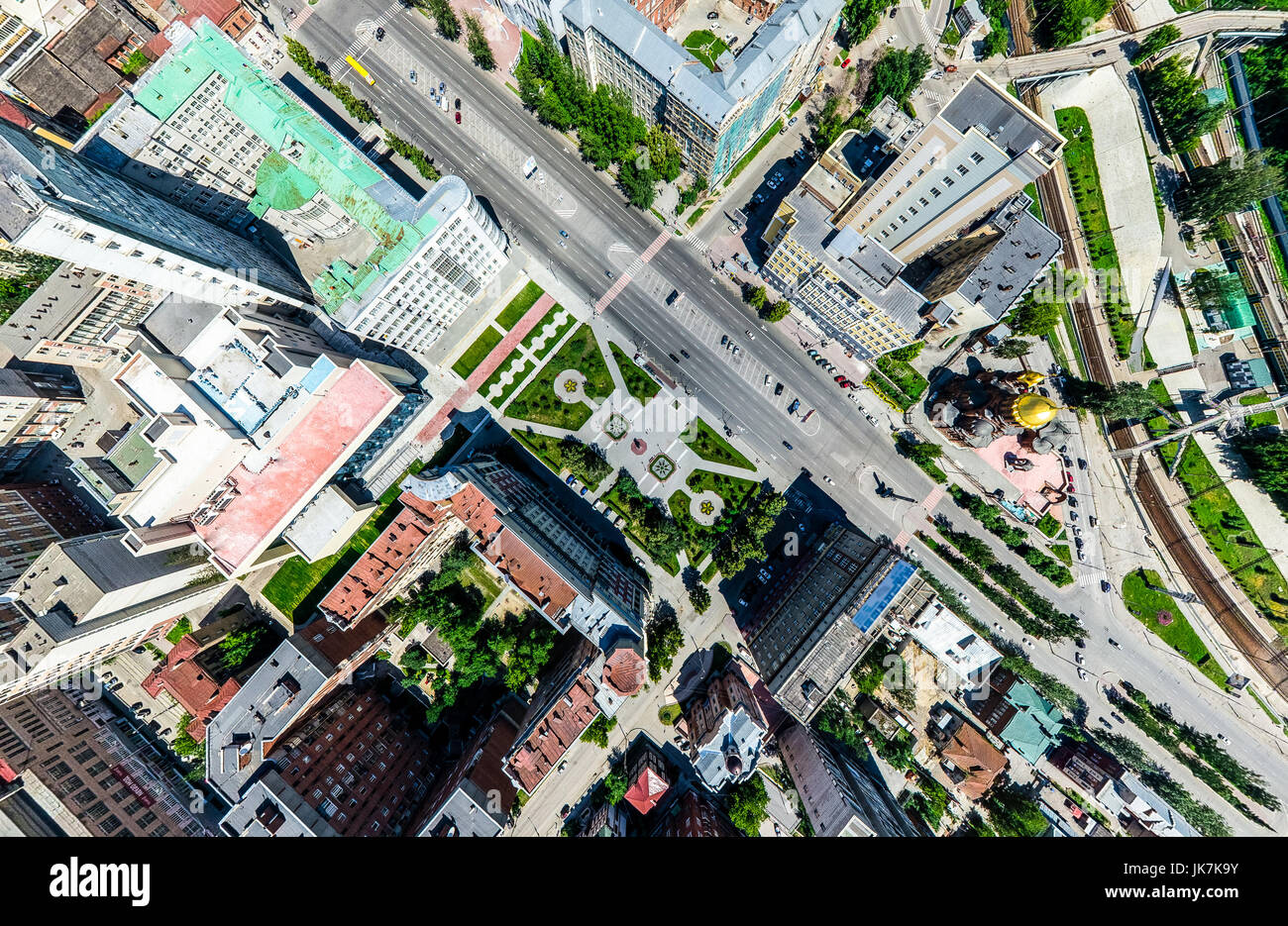 Aerial city view with crossroads and roads, houses, buildings, parks ...