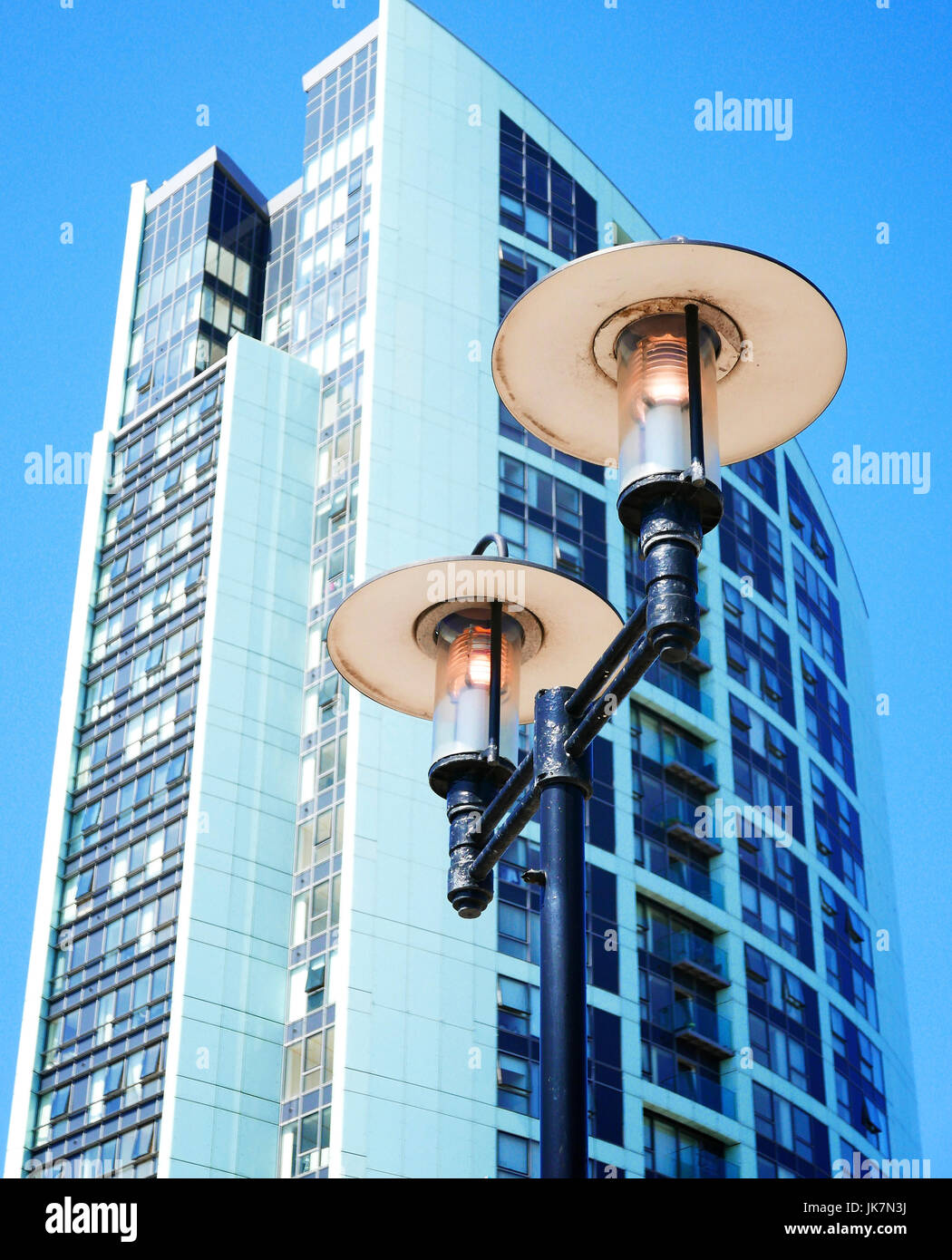 Ornate twin street lamp in front of Alexandra Tower office block ...