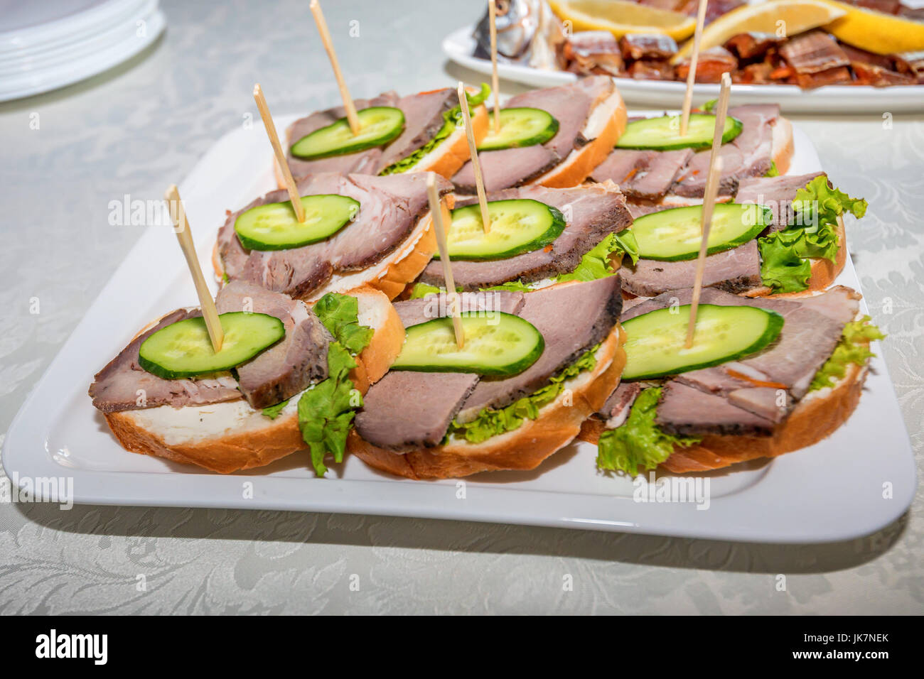 Smoked ham canape on plate Stock Photo - Alamy