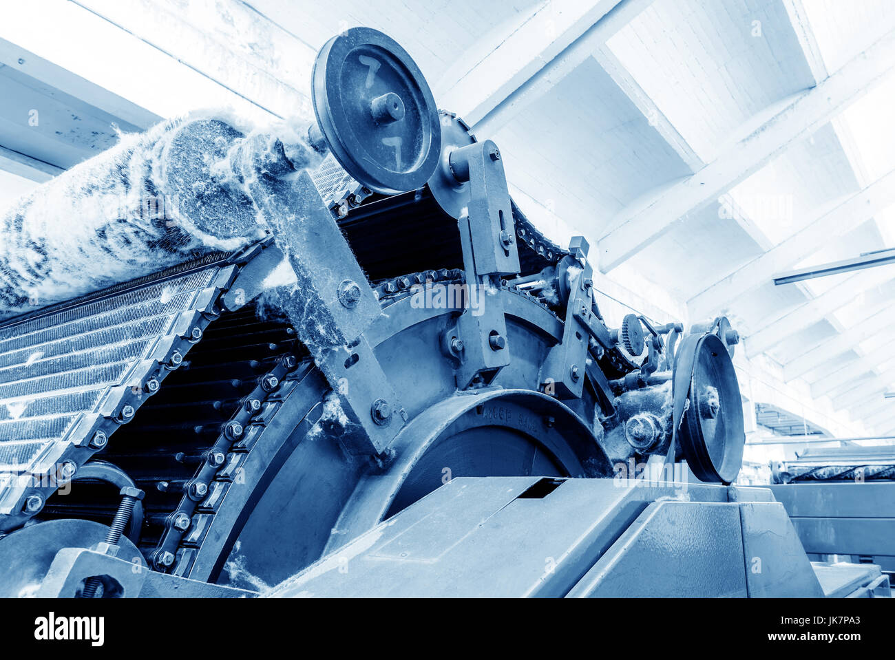 Features of carding machine in textile mill Stock Photo - Alamy