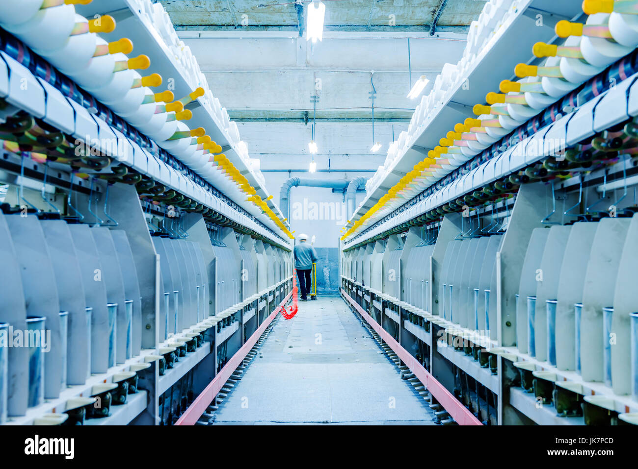 Weaving workshop, weaving machine is producing cloth Stock Photo - Alamy