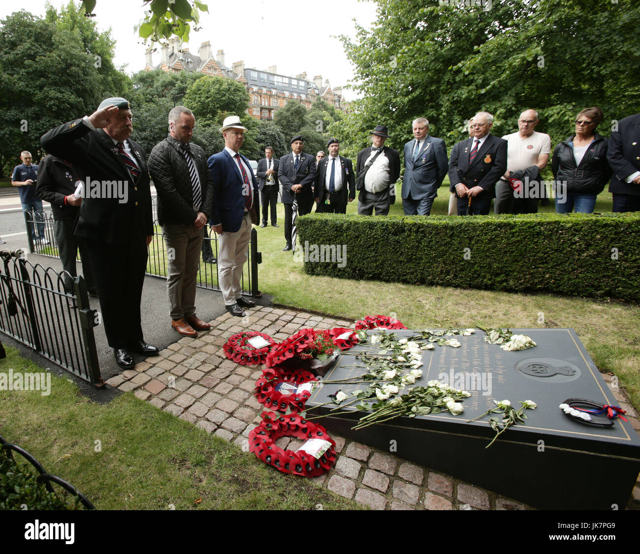 Mark Tipper (centre), whose 19-year-old brother Simon died in the blast ...
